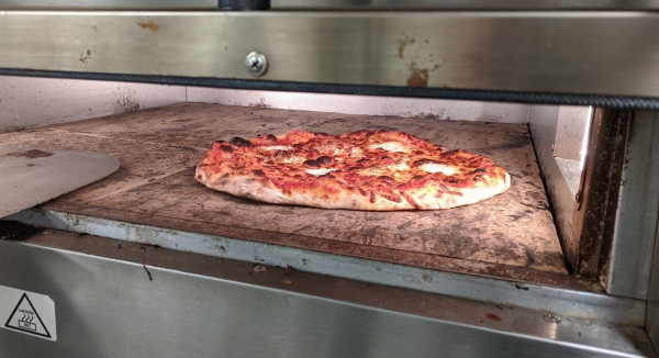 Back Door Pizza: Farm and Fisherman Dishes Takeout Pies in Speakeasy Style